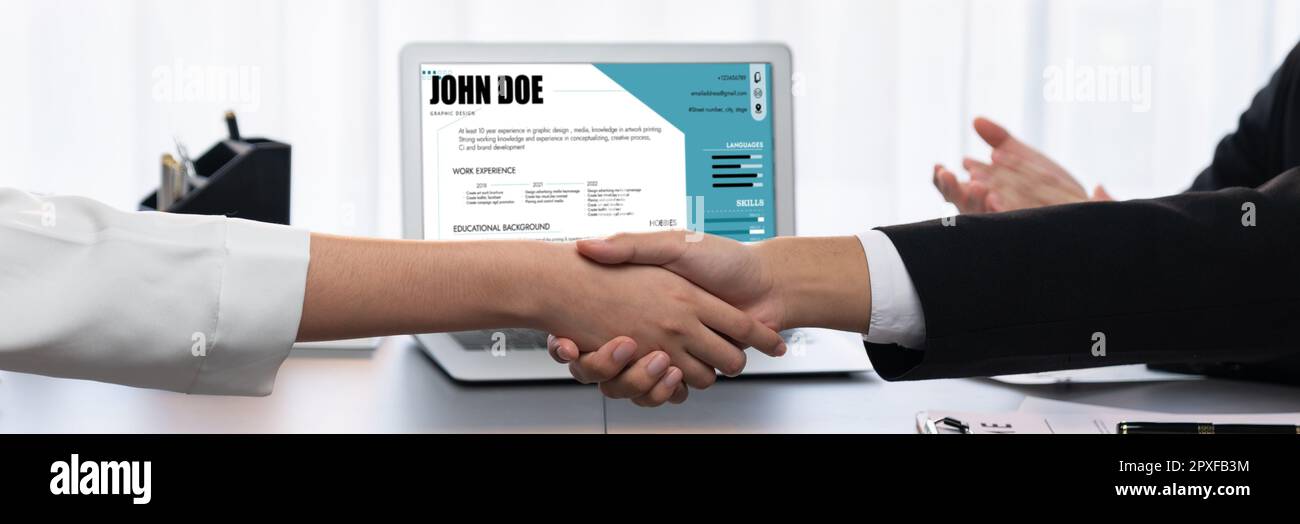 Interviewer handshaking the applicant hi-res stock photography and ...