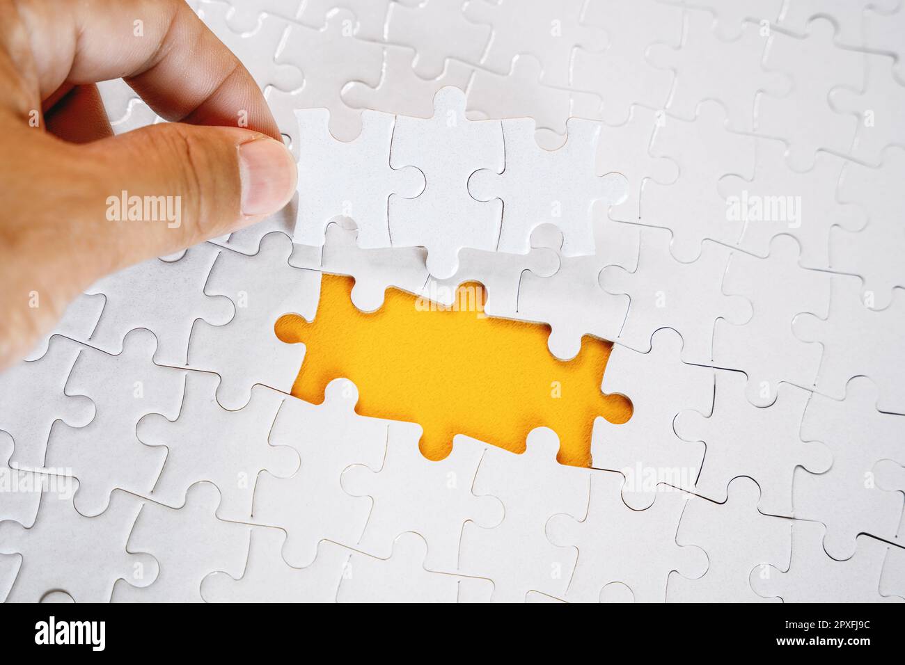 Solving puzzle hi-res stock photography and images - Alamy