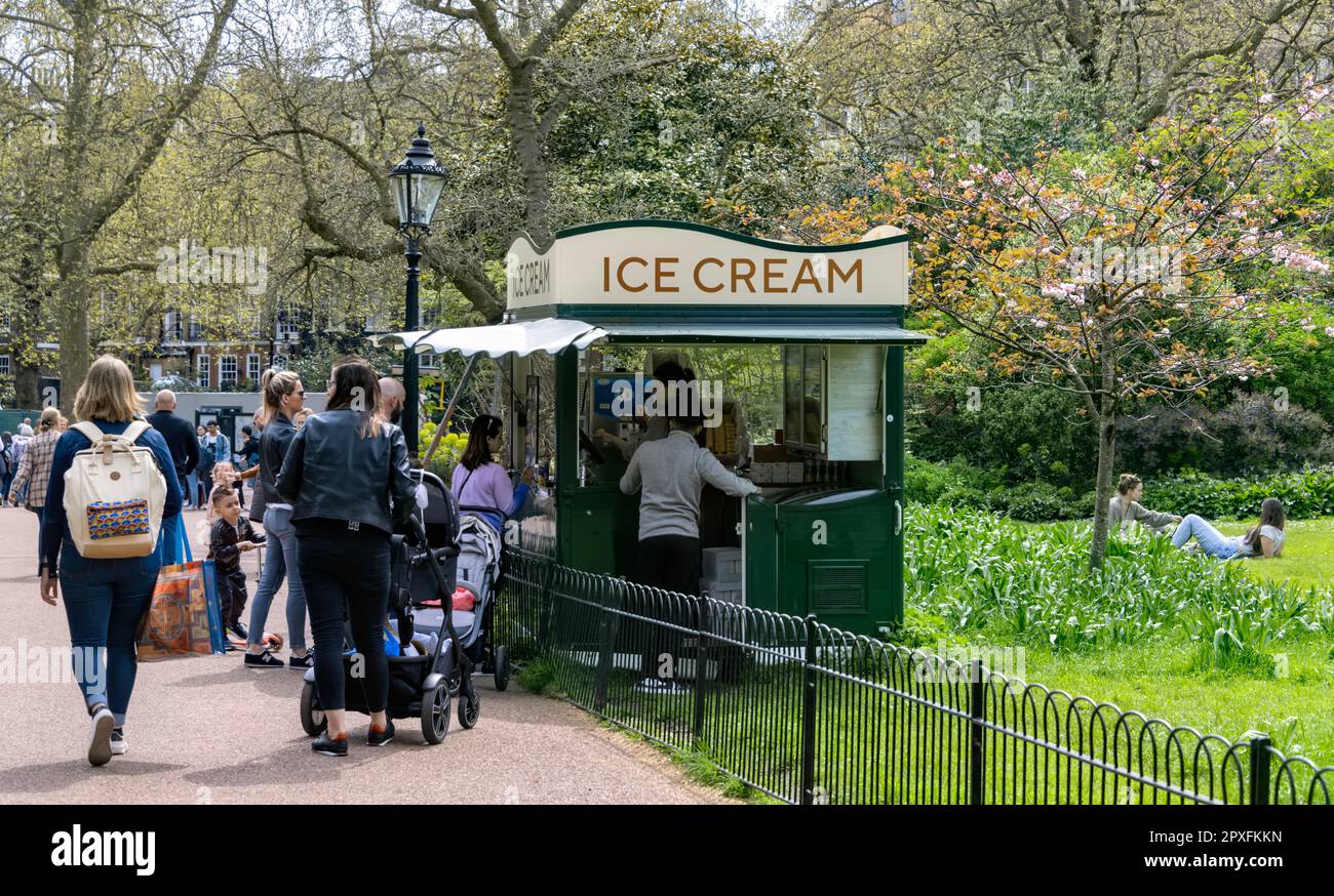 People in queue for ice cream in the grounds of St. James's Park, Lodon ...