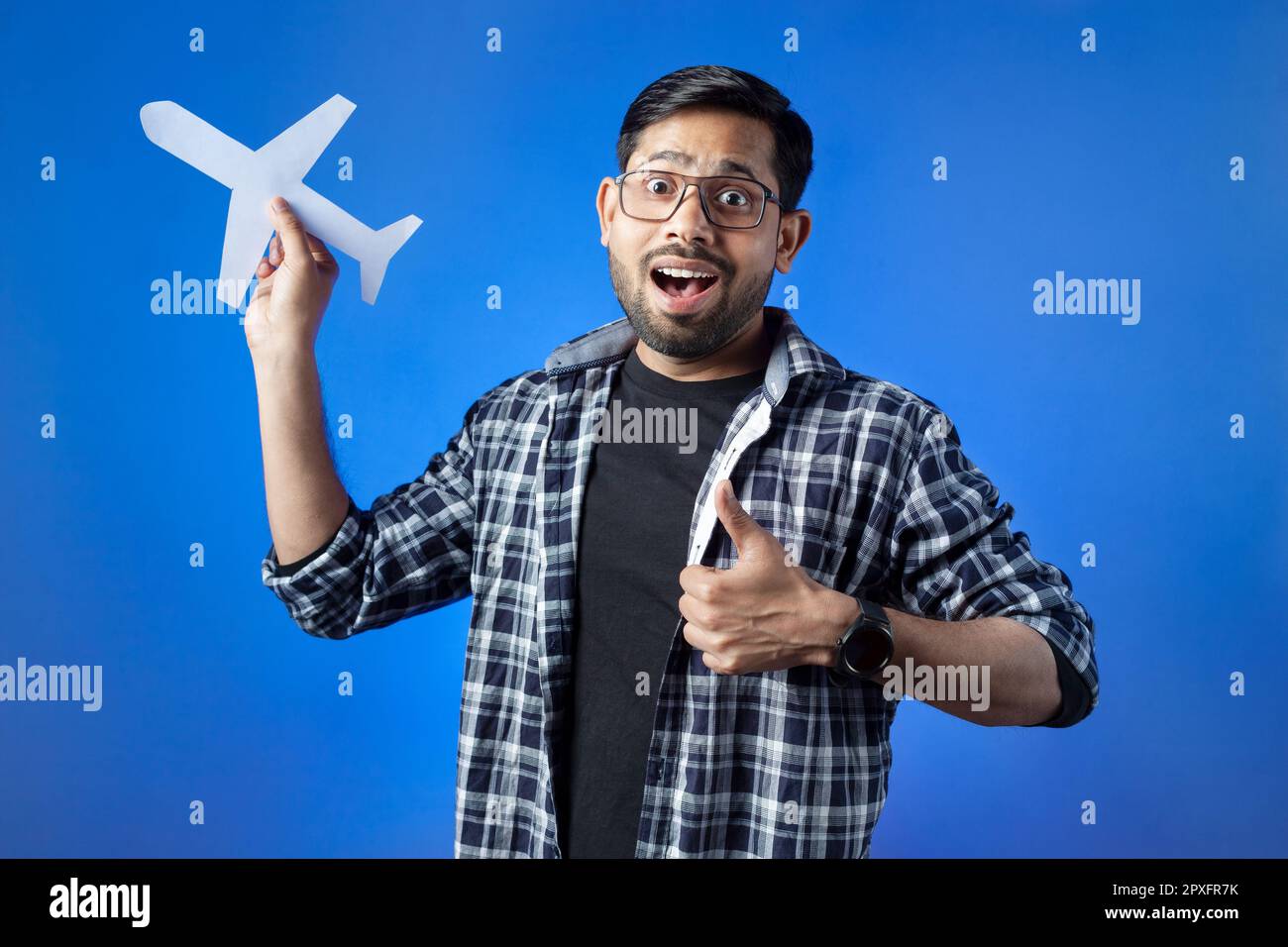 Indian ethnicity, toothy smile, journey, airplane. Man with thumb up ...