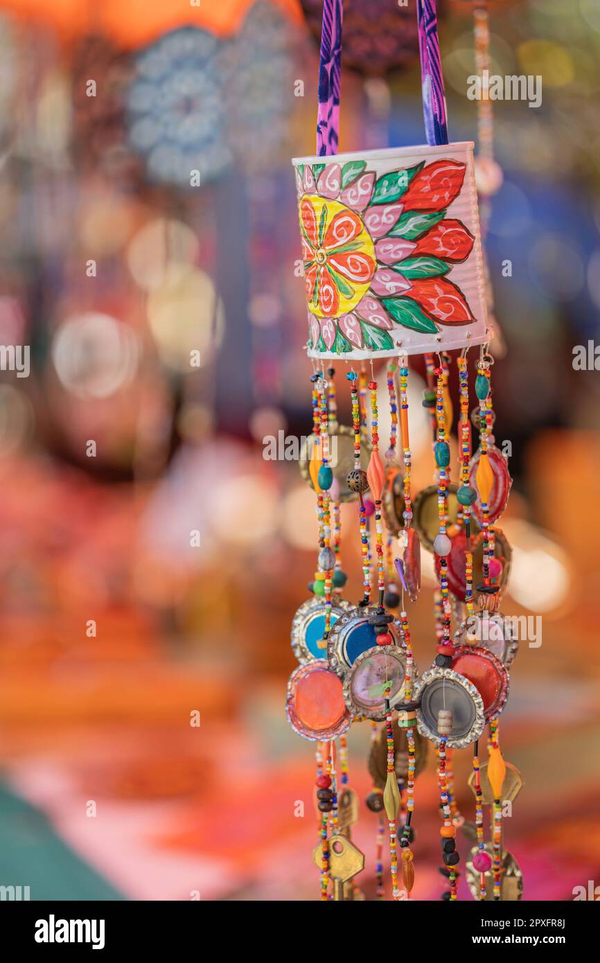Colorful home made hanging ornament with recycled canned food cans and ...