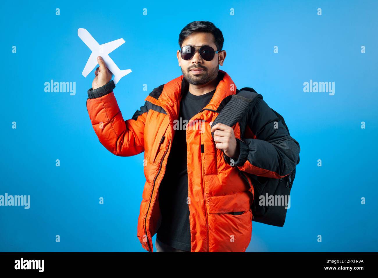 Travel destination, passenger, journey. One man holding a bag and paper ...