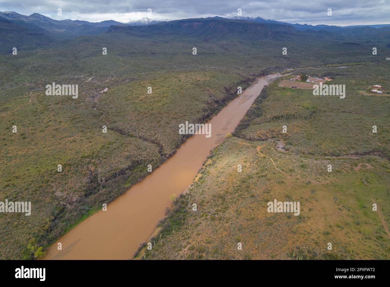 A tranquil scene of the Agua Fria River flowing peacefully after a ...