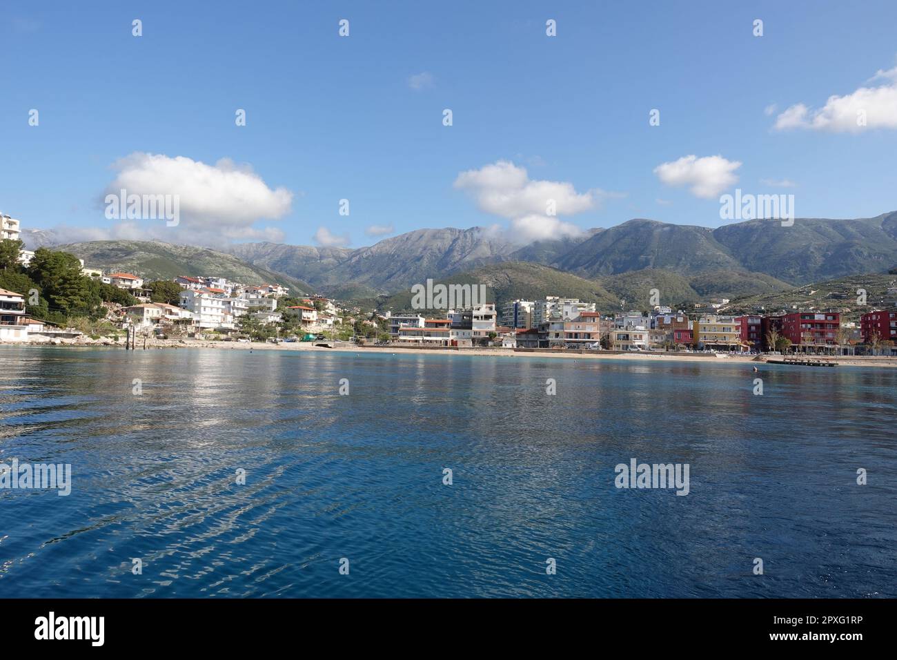 View looking towards Himare beach and town from the water, Albania ...