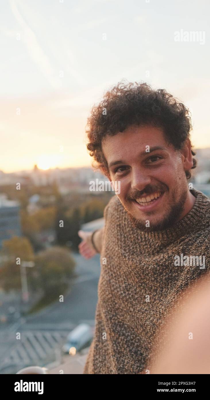 Man stands on balcony sunset hi-res stock photography and images - Alamy