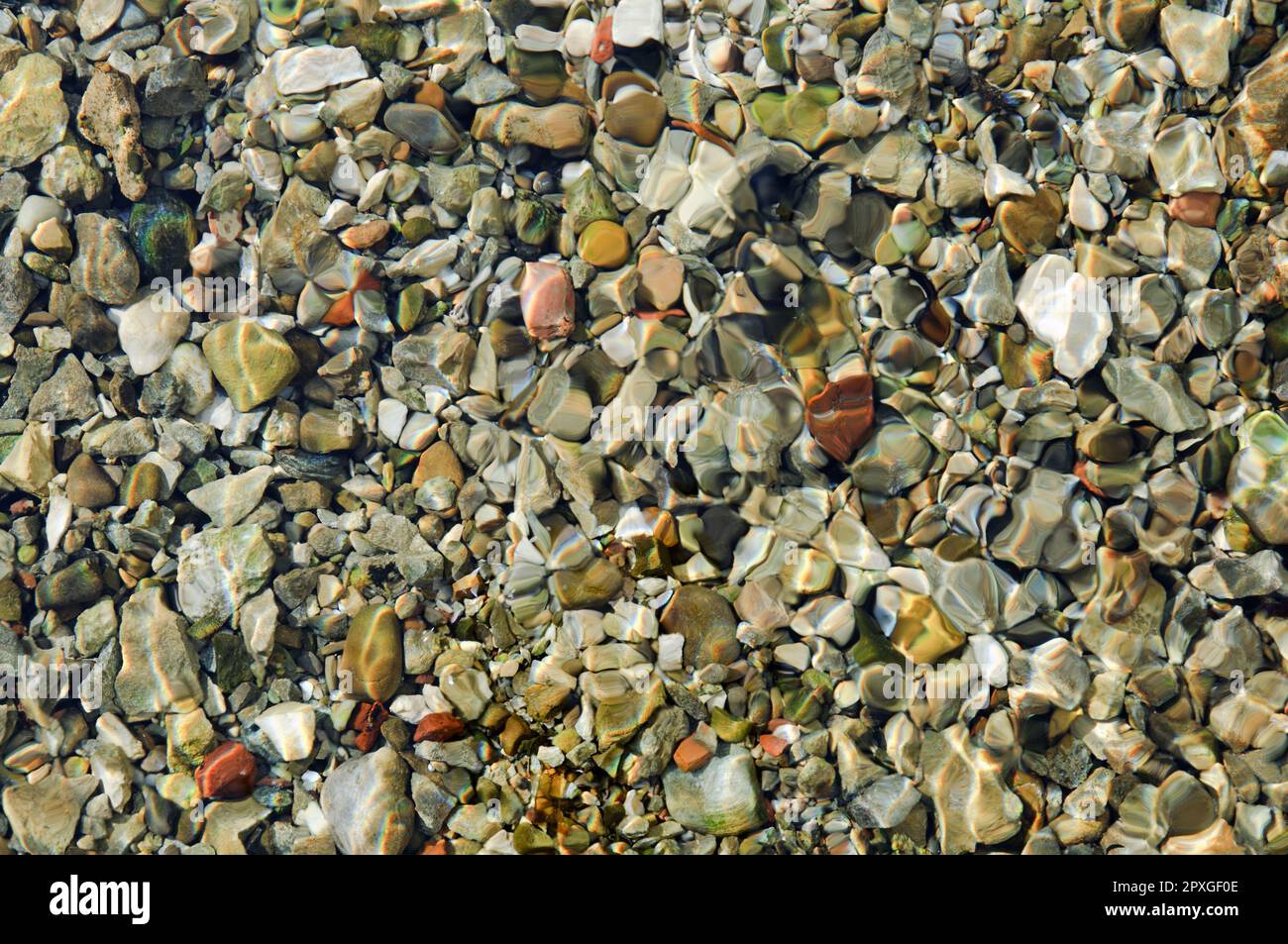 An image featuring the texture of rocks and stones in a body of water ...