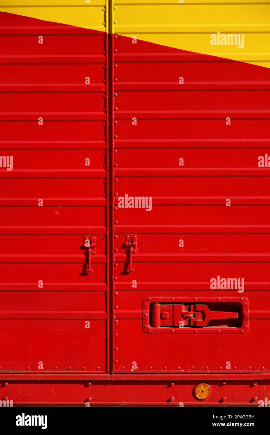 A vertical close-up view of a large track entrance featuring a bright ...