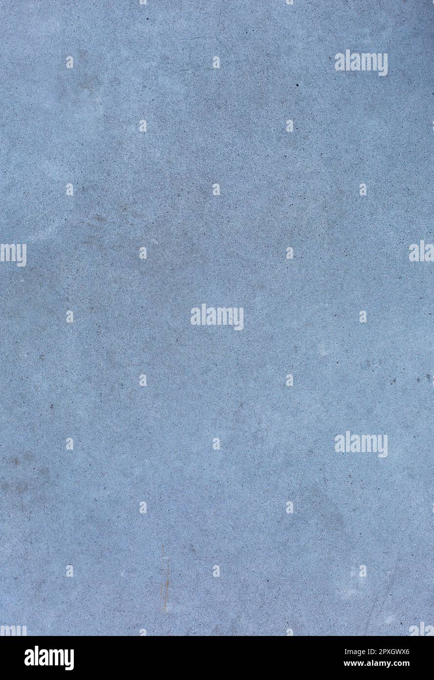 Vertical shot of a textured wall with subtle shadows and highlights ...