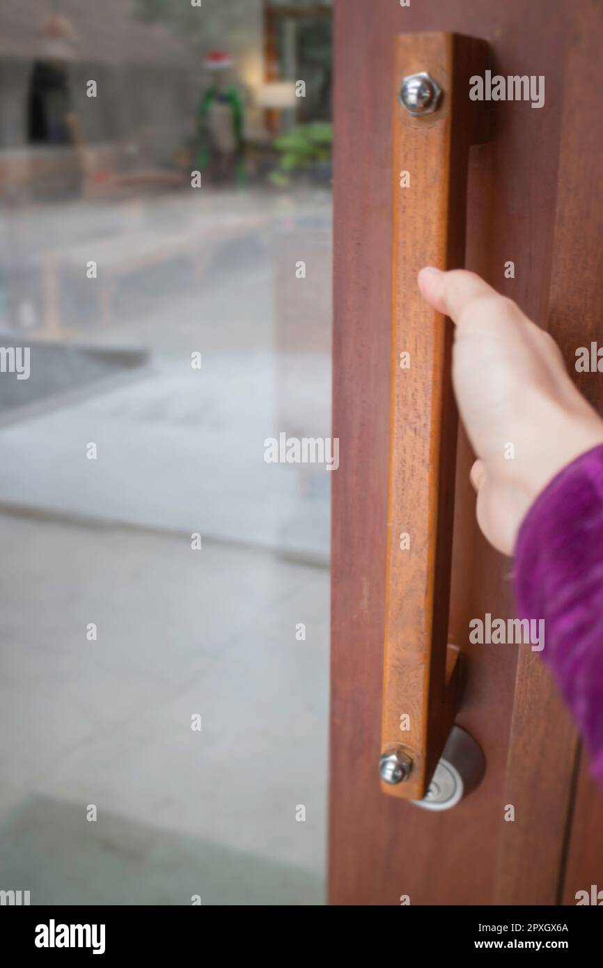 Woman push door open hi-res stock photography and images - Alamy