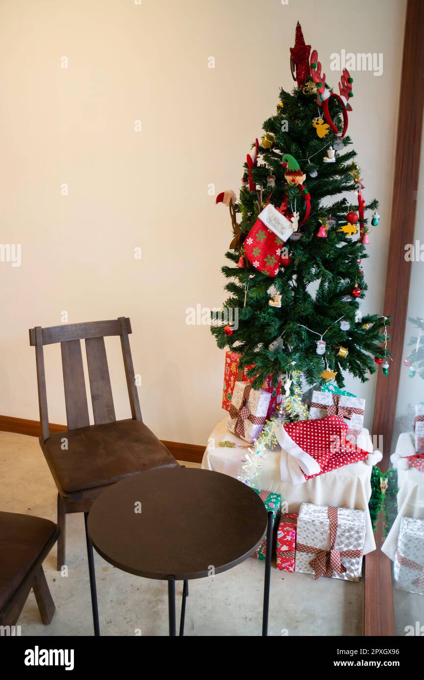 Christmas tree decor on the window of a wooden house, stock photo Stock ...