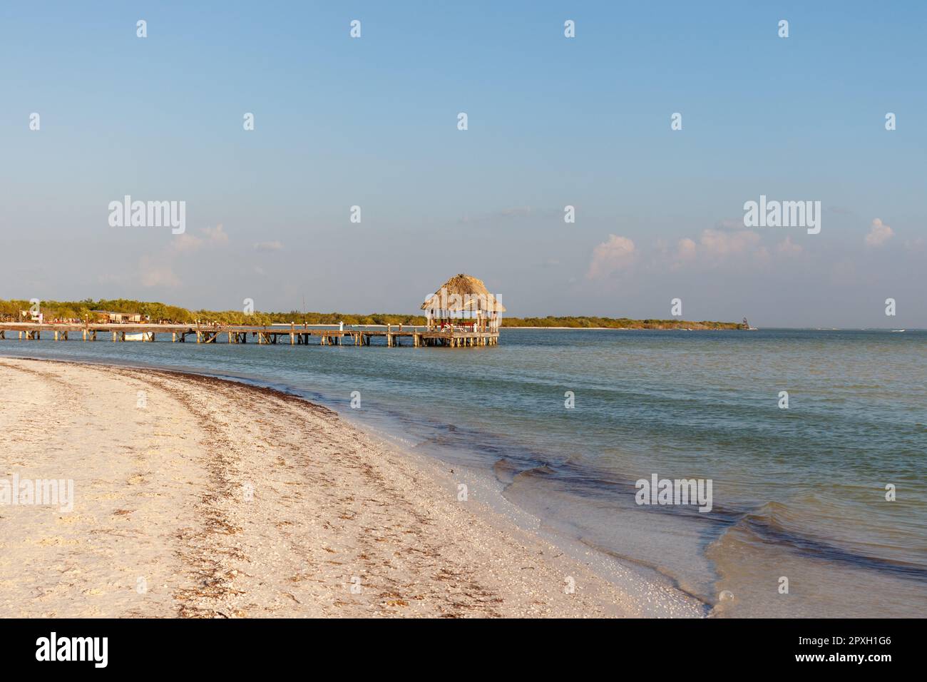 Punta Coco beach wooden deck pier leading into ocean. In Holbox ...