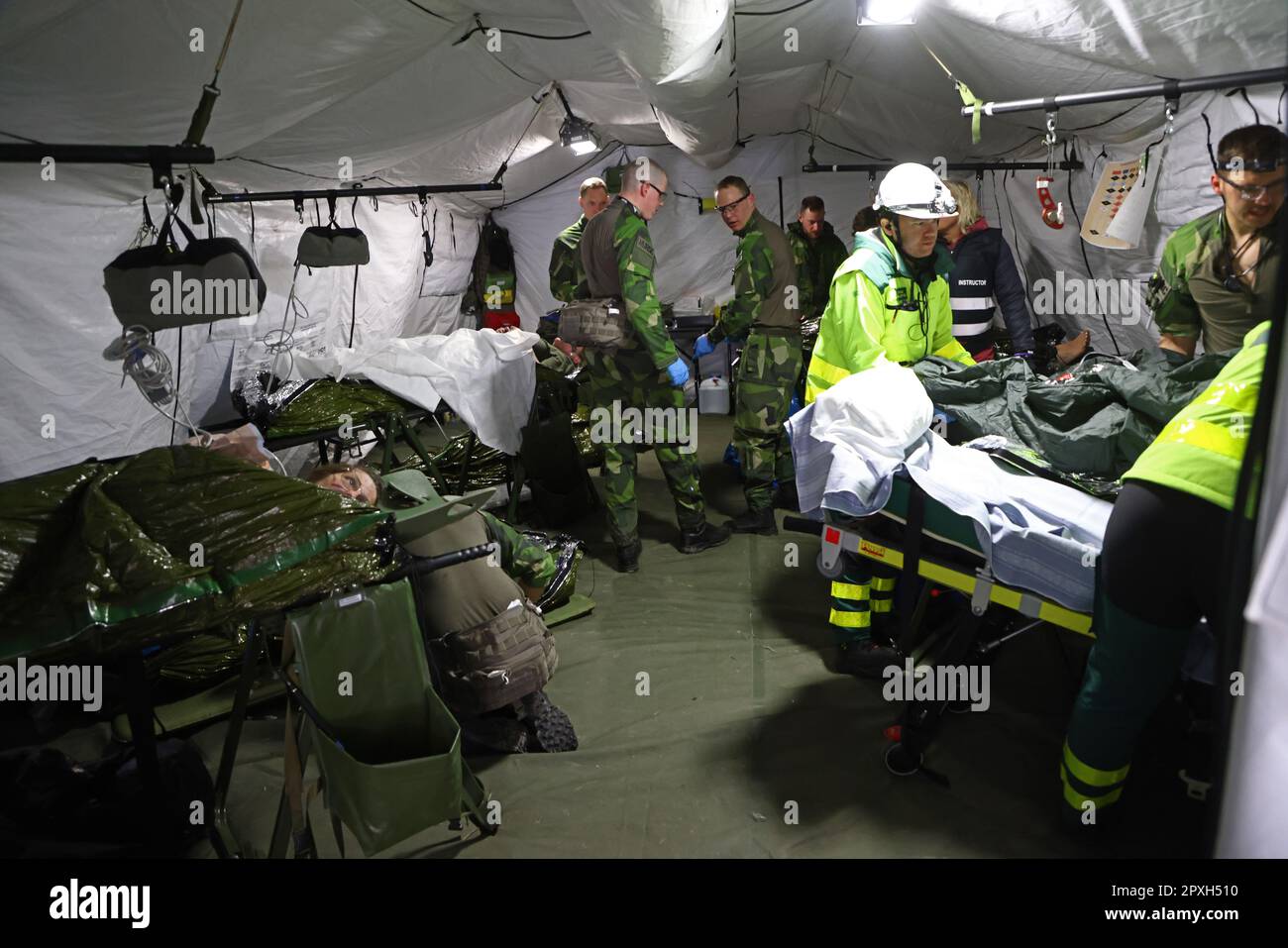 Patients and medical staff inside a field hospital during the large ...