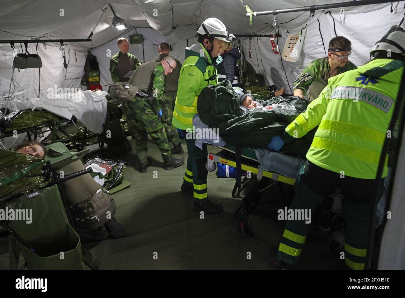 Patients and medical staff inside a field hospital during the large ...