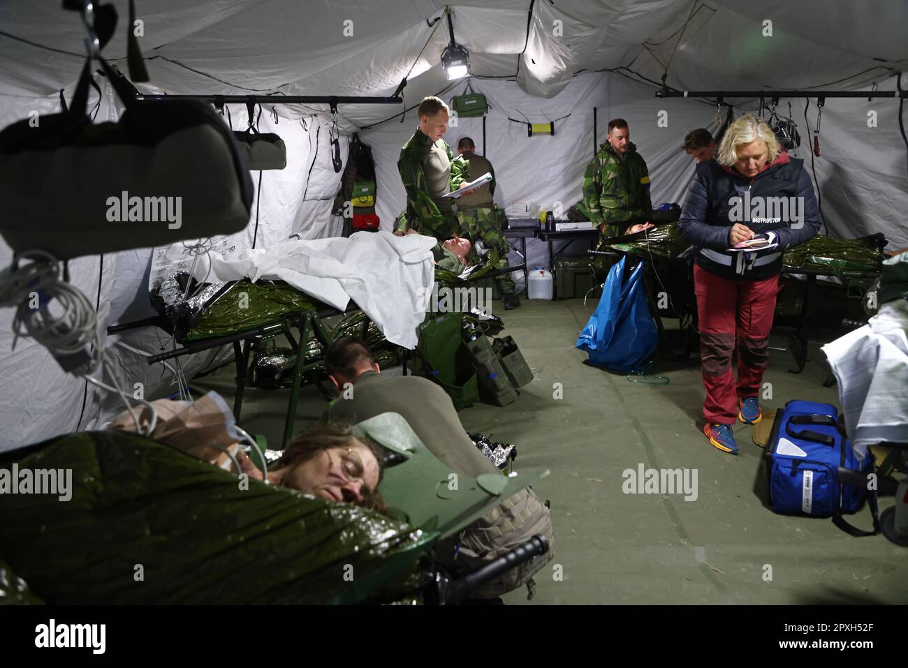 Patients and medical staff inside a field hospital during the large ...
