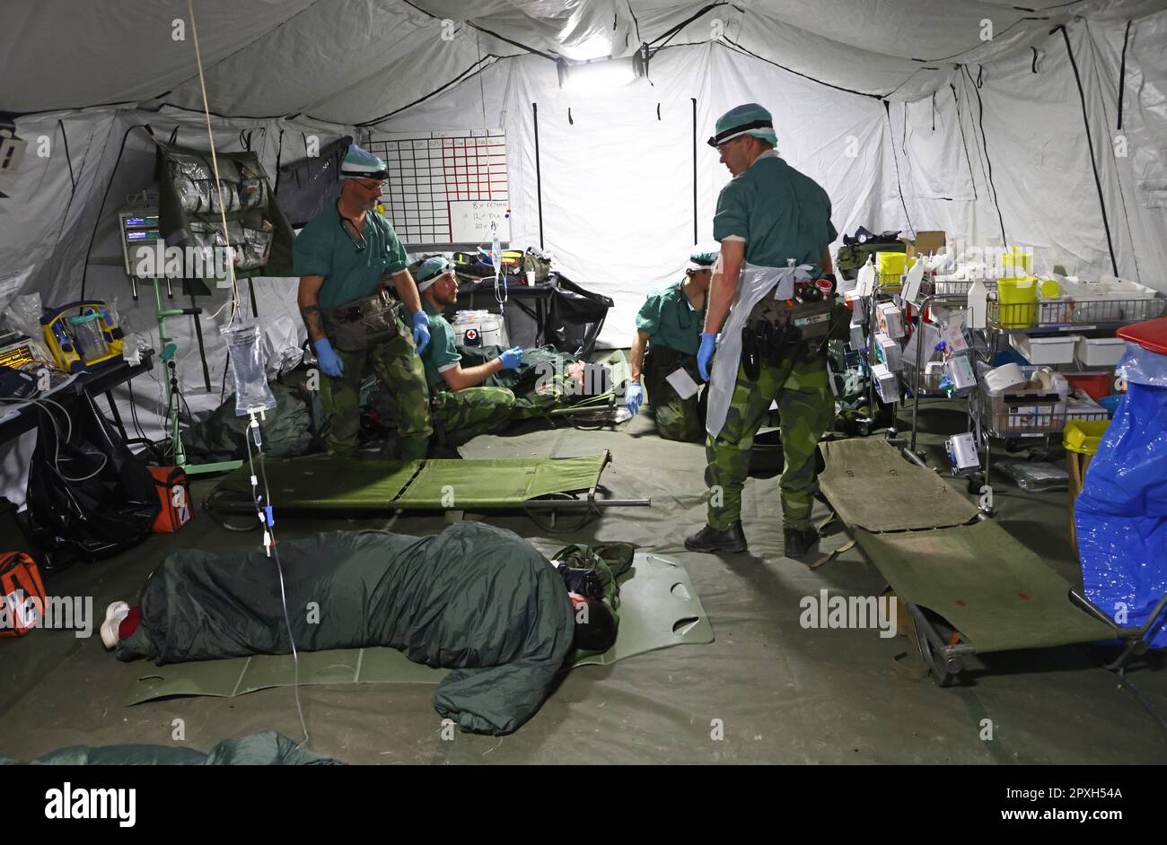 Patients and medical staff inside a field hospital during the large ...