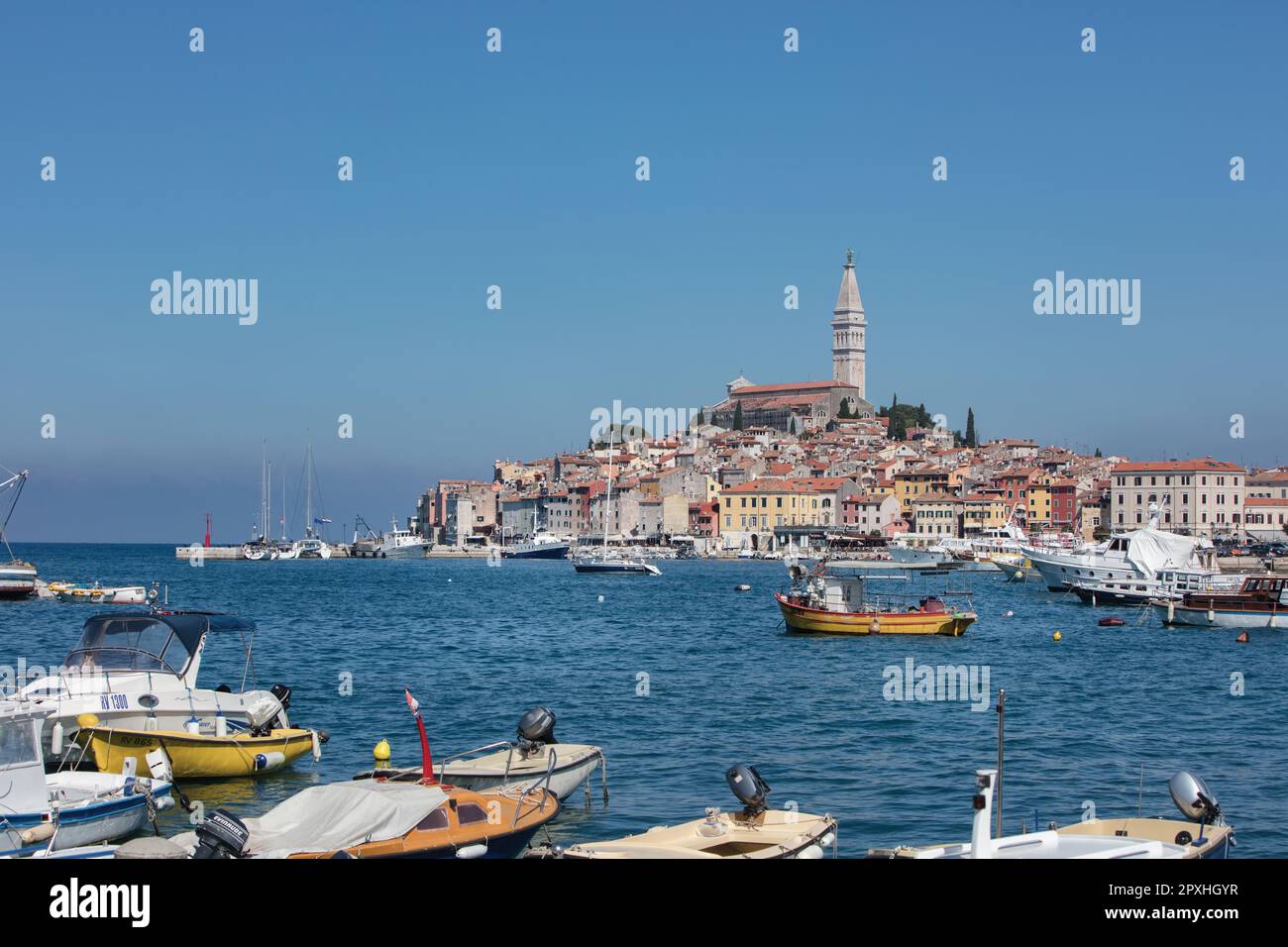 Rovinj or Rovigo Old Town in Istria seen across Adriatic Sea with boats ...
