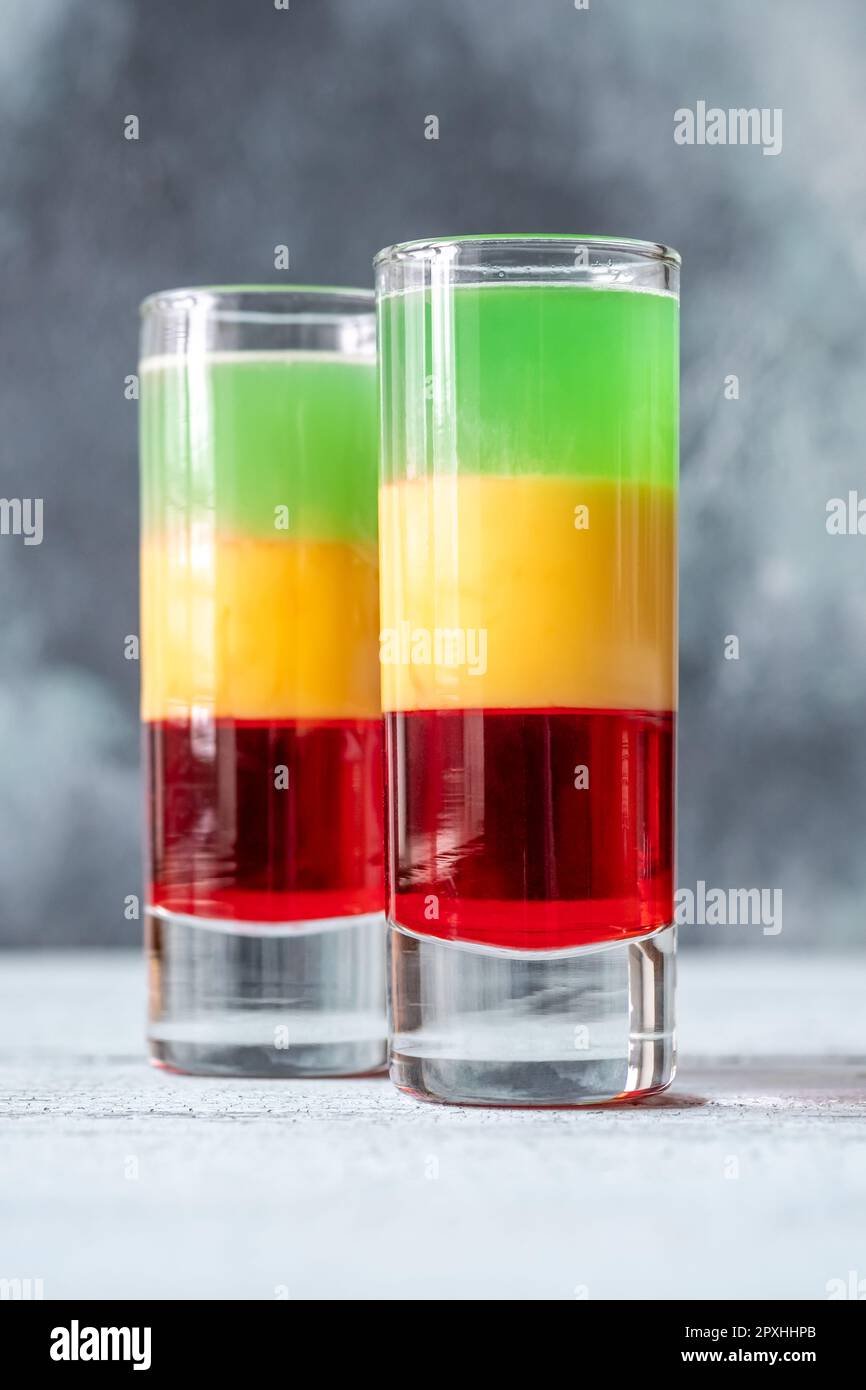 Layered Squashed Frog Cocktail in shot glass Stock Photo - Alamy