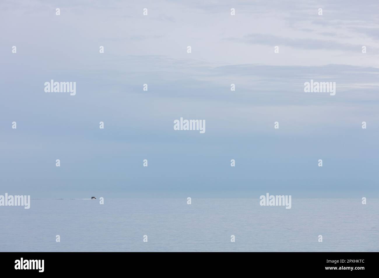 Small fishing boast heads into the peaceful, serene Adriatic Sea seen ...