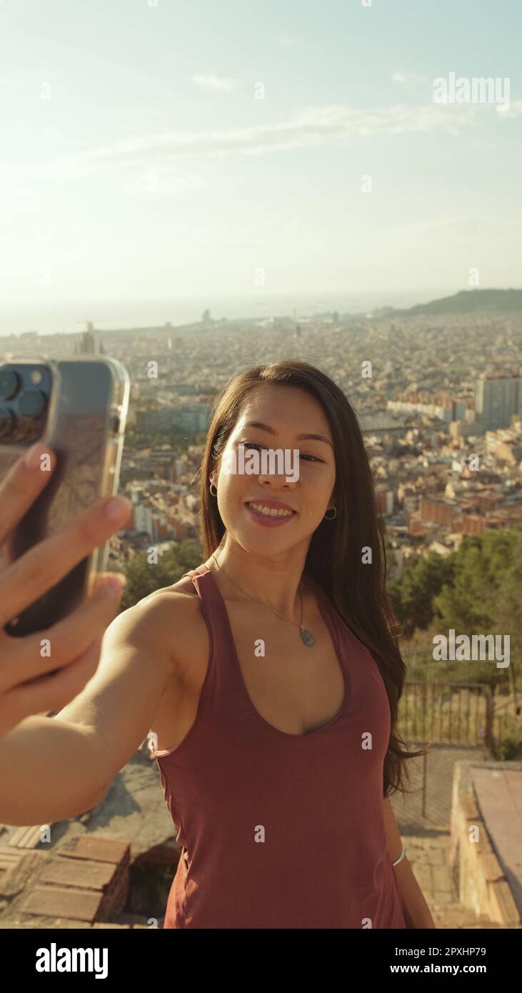 Close up, laughing sporty woman making video call from mobile phone ...