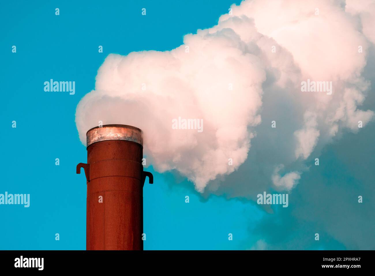Pipe and smoke on sky background.Polluting air with white smoke from ...