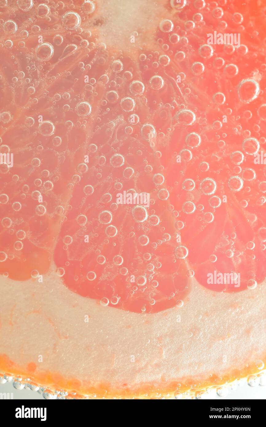 Close-up of juicy grapefruit slice on white background. Slice of red ...