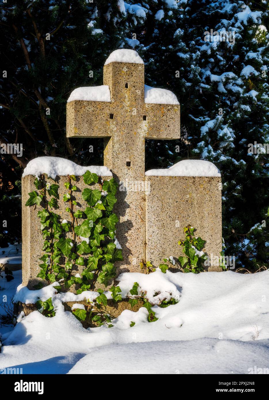 Snow covered historic crucifix in a cemetry Stock Photo - Alamy