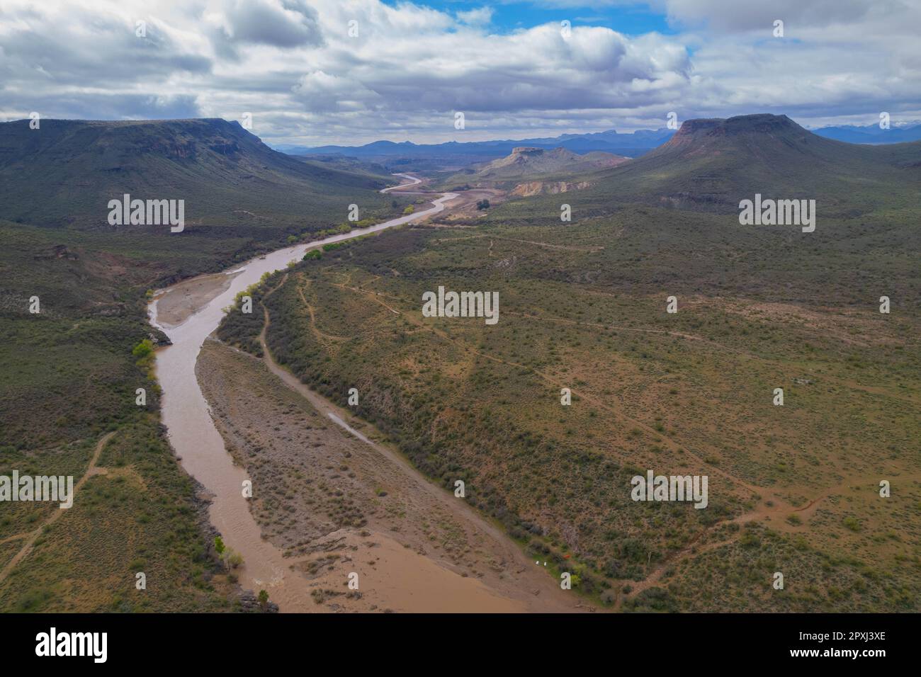 Agua Fria River flowing after a winter storm with lake pleasant in the ...