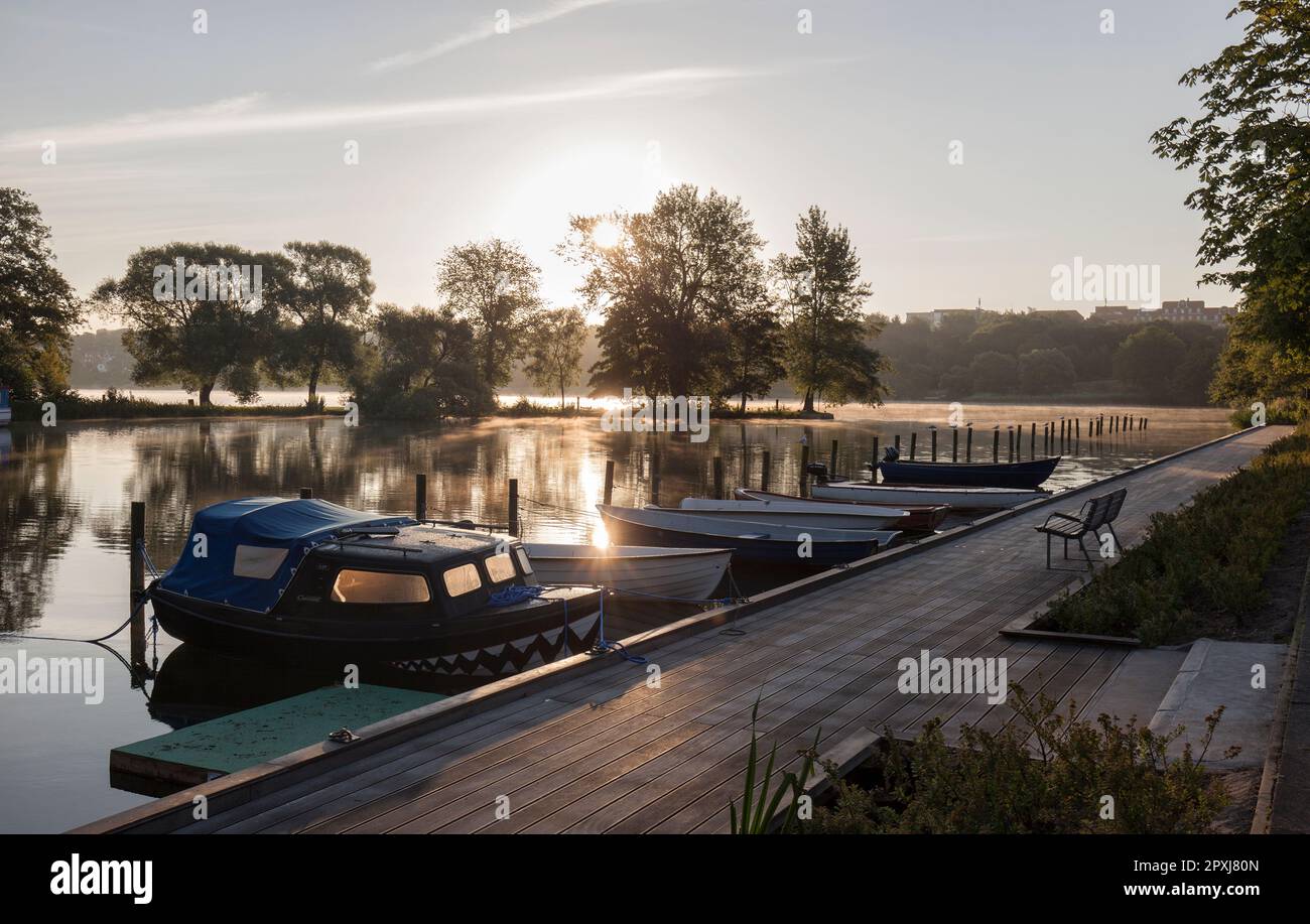 Sunrise on paddle boats and small pleasure craft by canoe and kayak ...