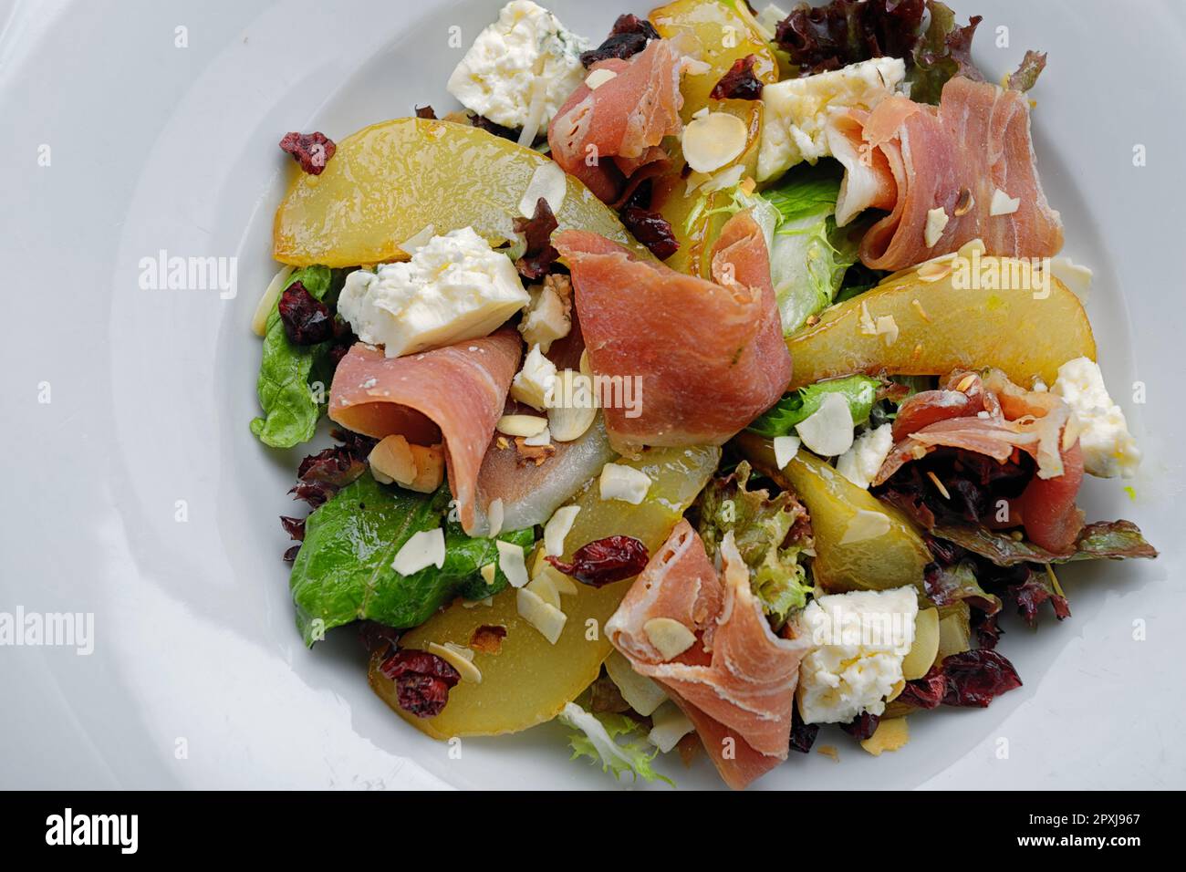 classic salad with pear, ham, cheese and nuts Stock Photo - Alamy