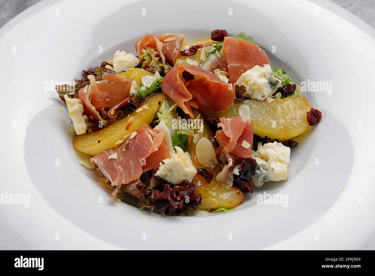 classic salad with pear, ham, cheese and nuts Stock Photo - Alamy