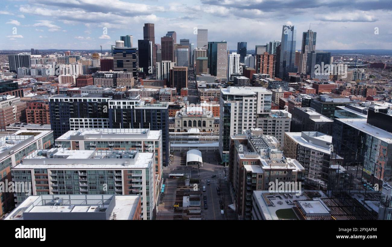 An aerial view of skyscrapers of Denver, Colorado under a cloudy sky ...