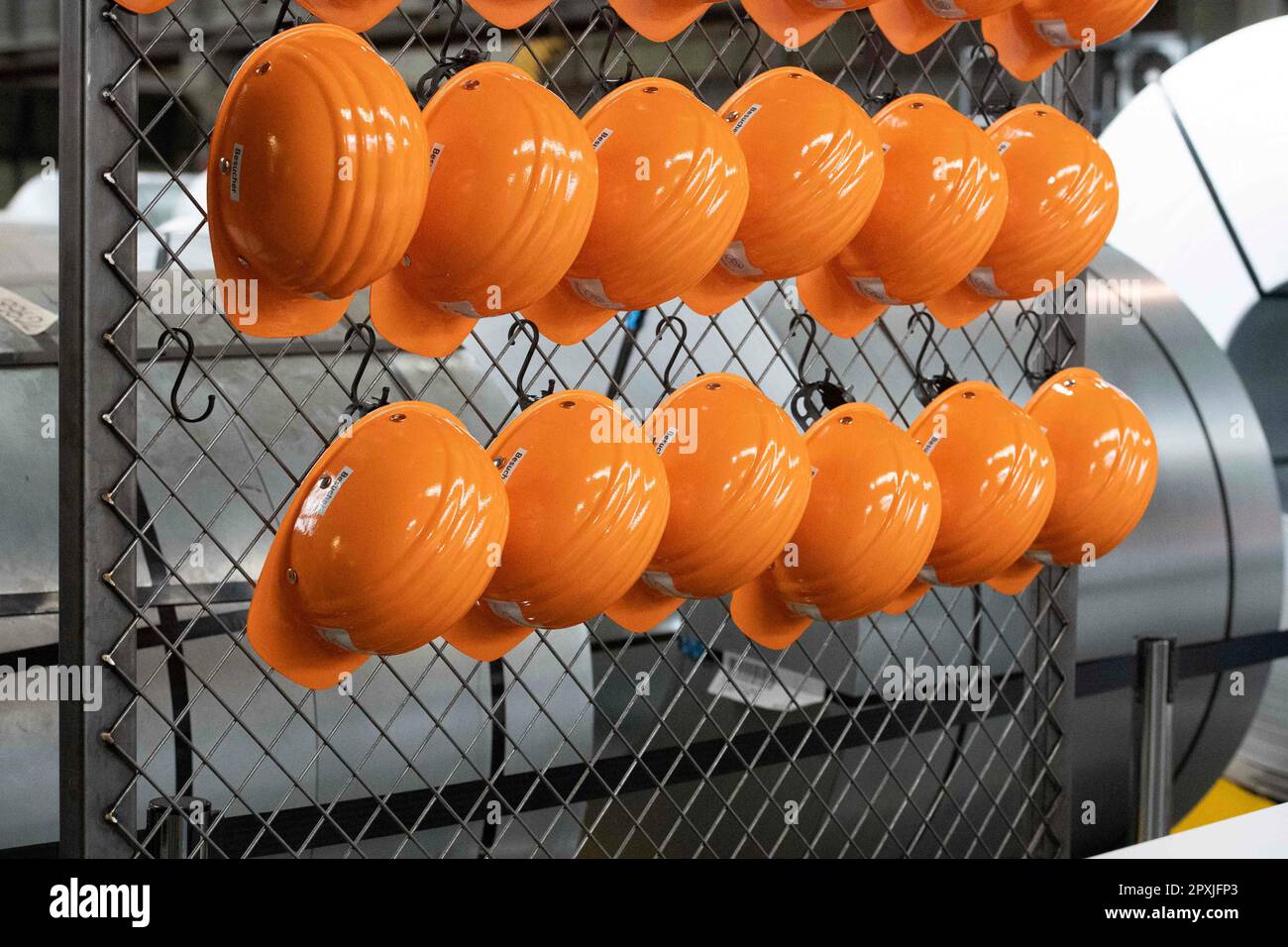 Steel workers' helmets hang on a lattice, visit of Federal President ...
