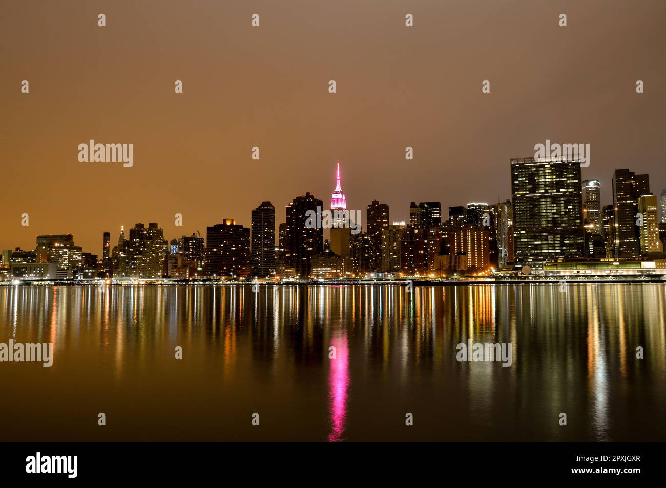 A stunning nighttime view of New York cityscape at night with buildings ...