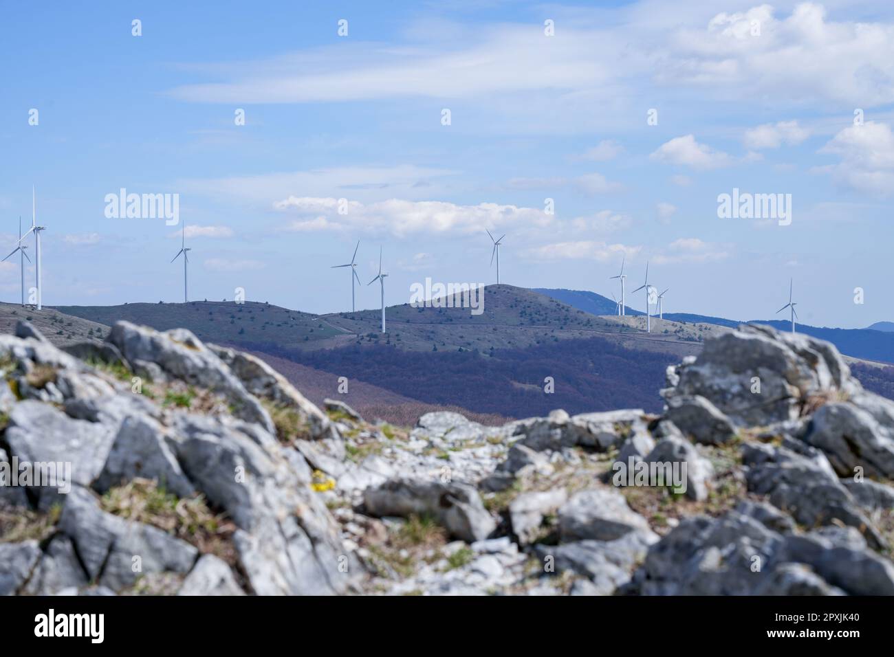 A vast landscape featuring multiple rows of large and small wind ...