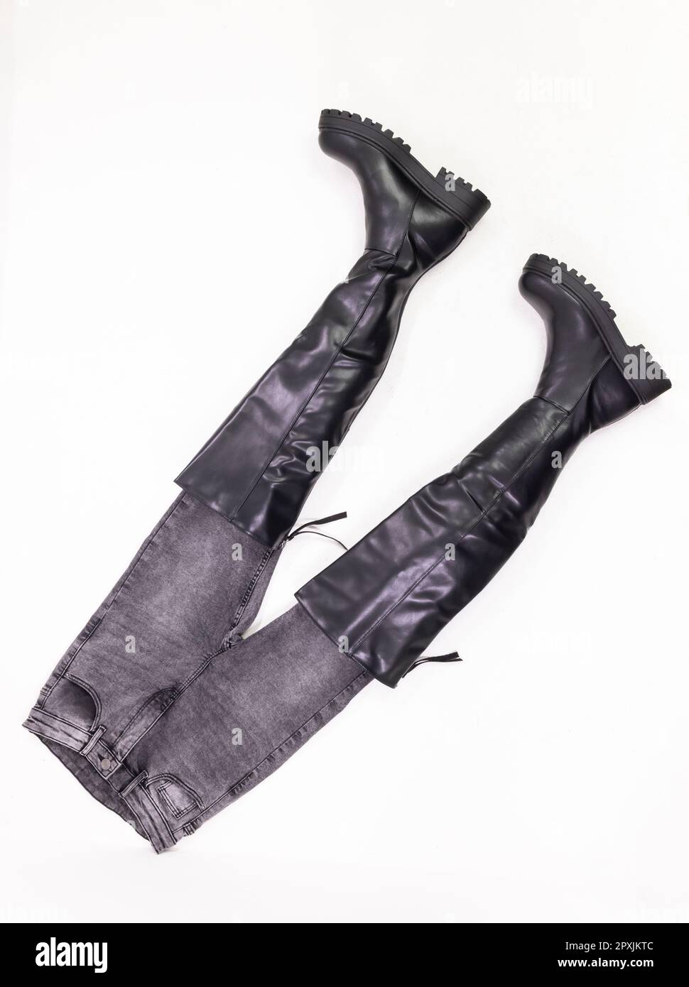 flat lay of grey jeans and black boots Stock Photo - Alamy