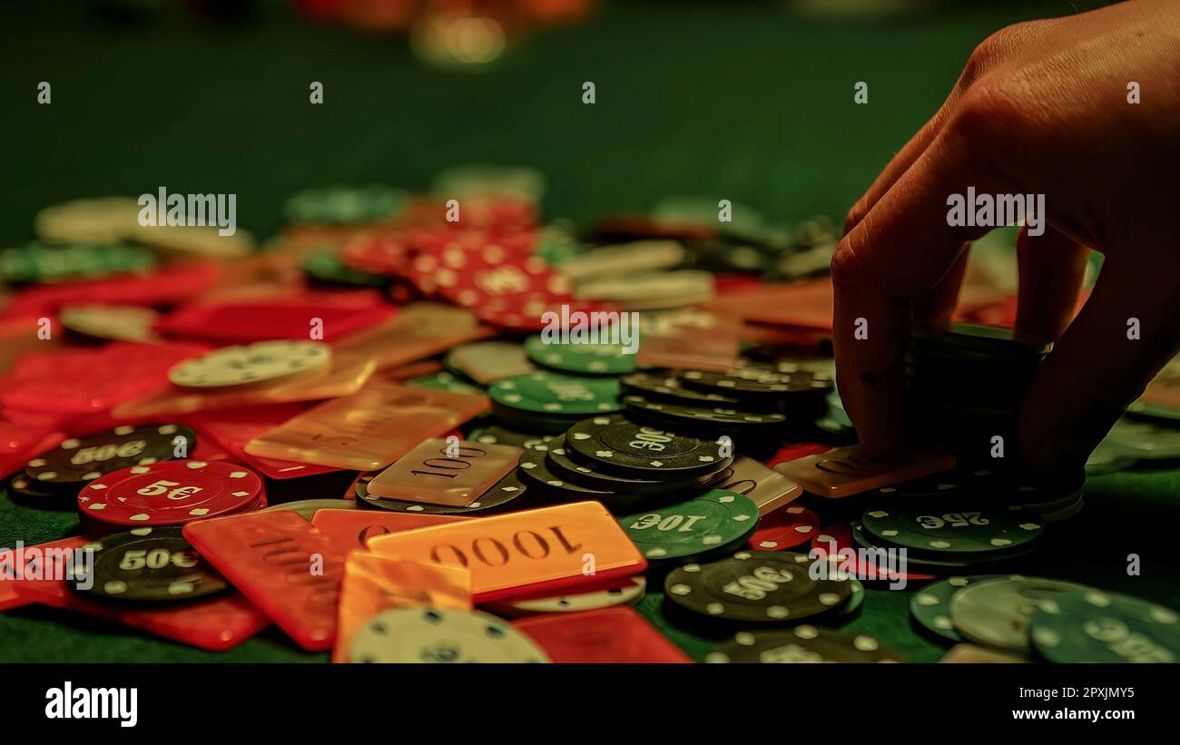 A chaotic scene of a poker game with chips scattered haphazardly across ...