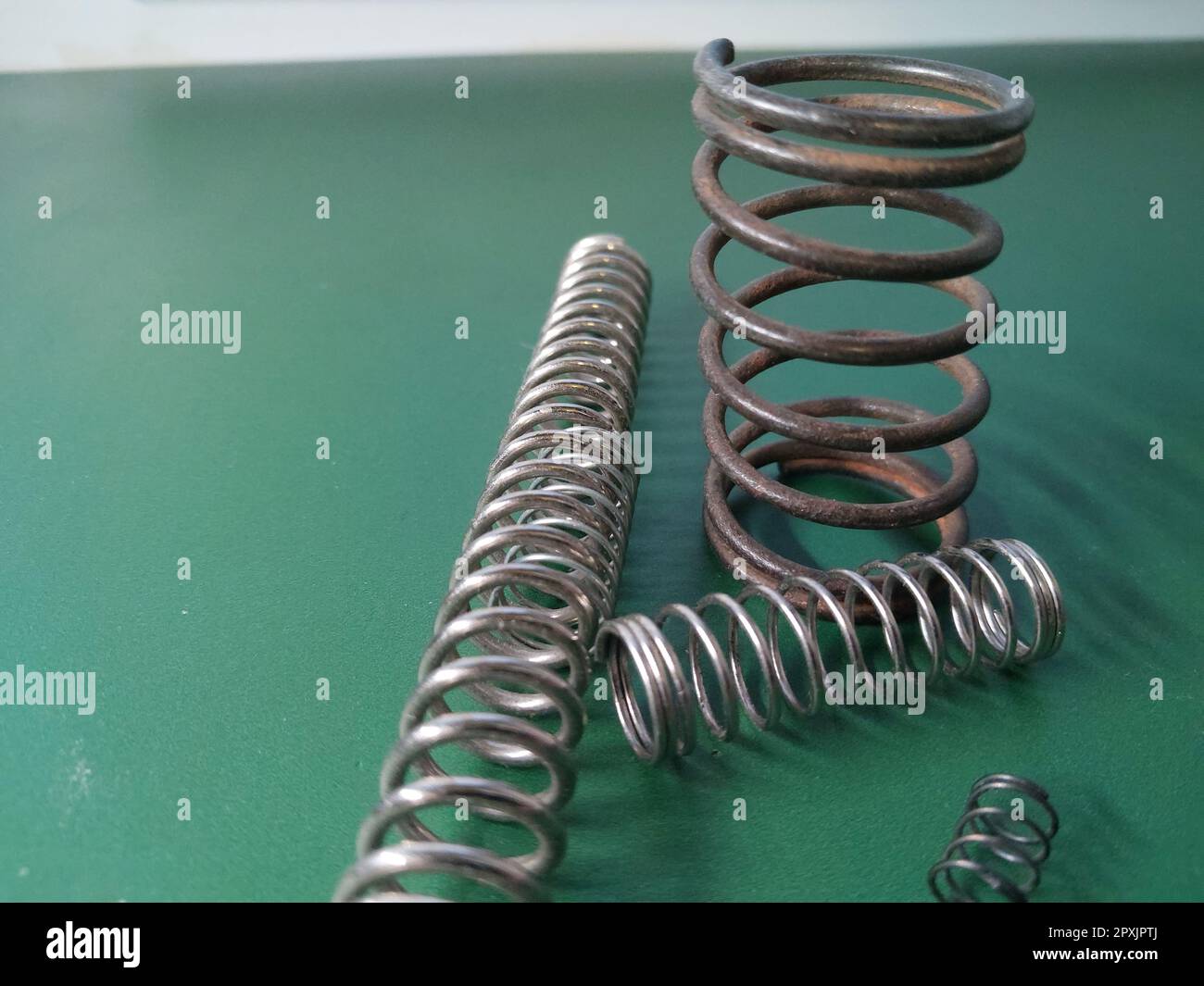 Metal spring for the technical products Stock Photo - Alamy