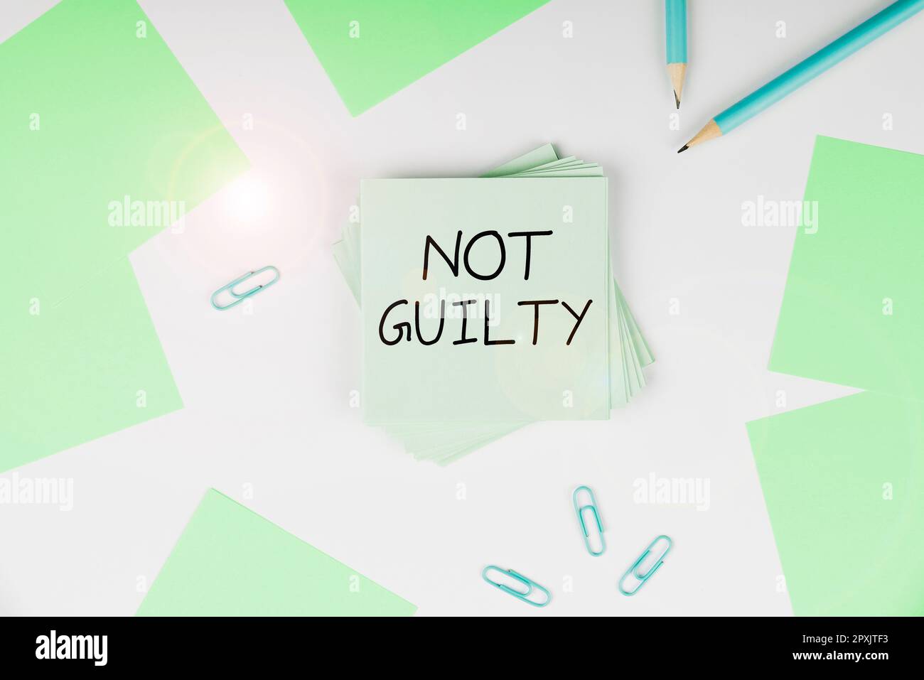 Hand writing sign Not Guilty, Word for someone is innocent didnt commit ...