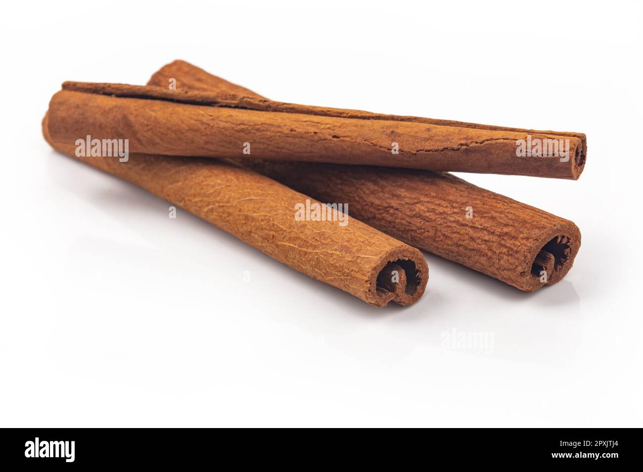 Dried Cinnamon sticks isolated over white background Stock Photo - Alamy