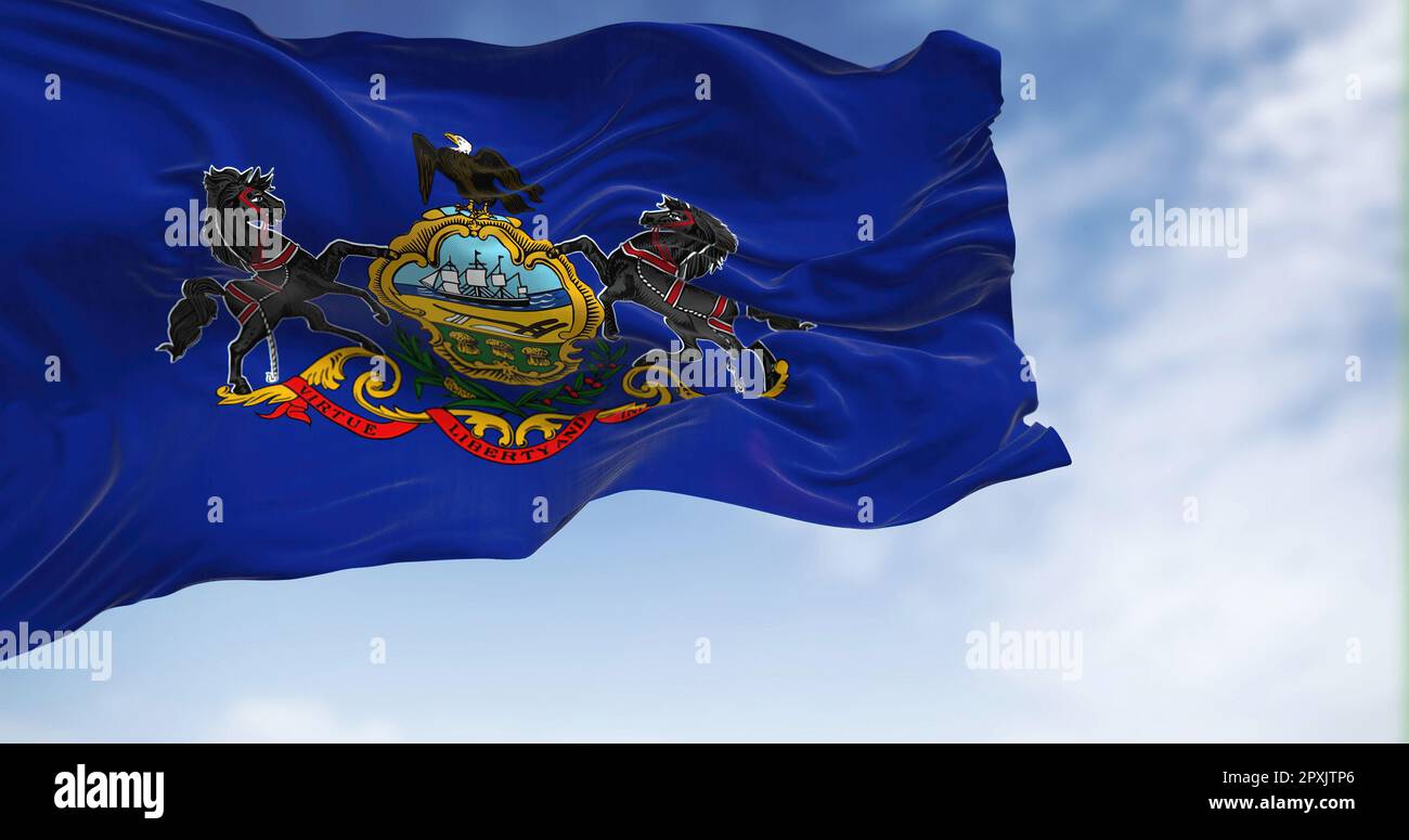 Pennsylvania state flag waving in the wind on a clear day. Blue flag ...