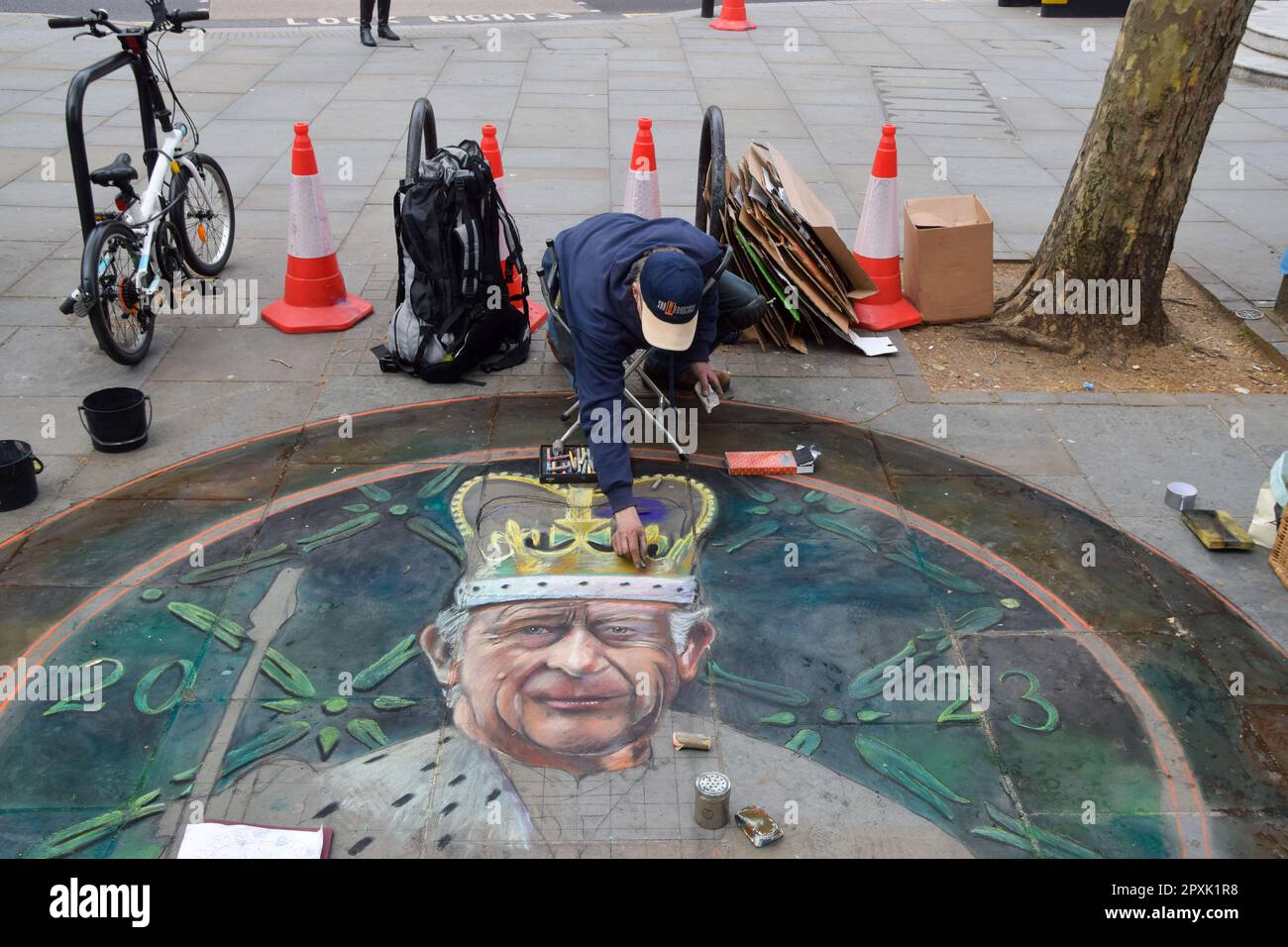 London, UK. 2nd May 2023. Chalk artist Julian Beever draws a picture of ...