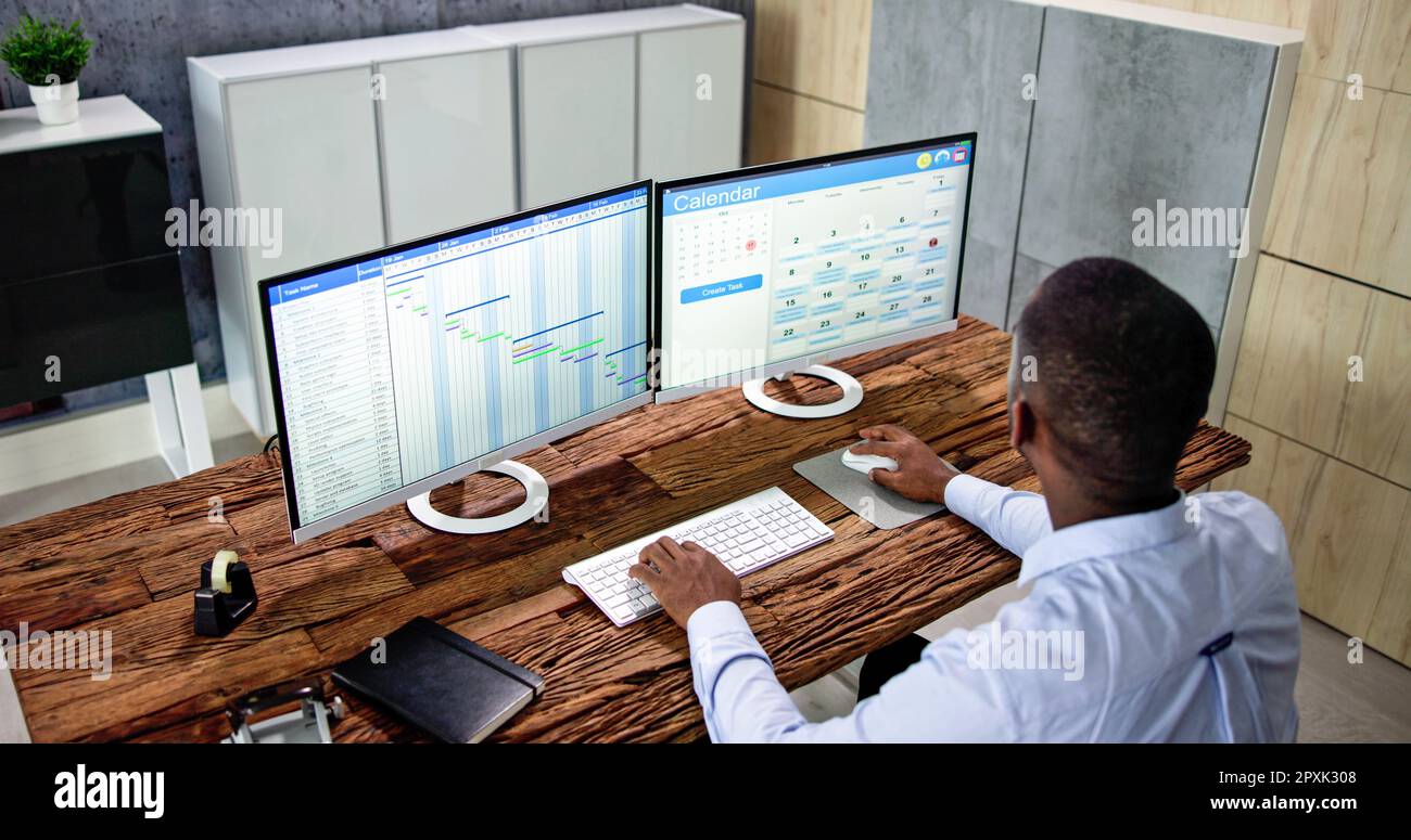 Gantt Chart Calendar Schedule On Multiple Computers Stock Photo - Alamy
