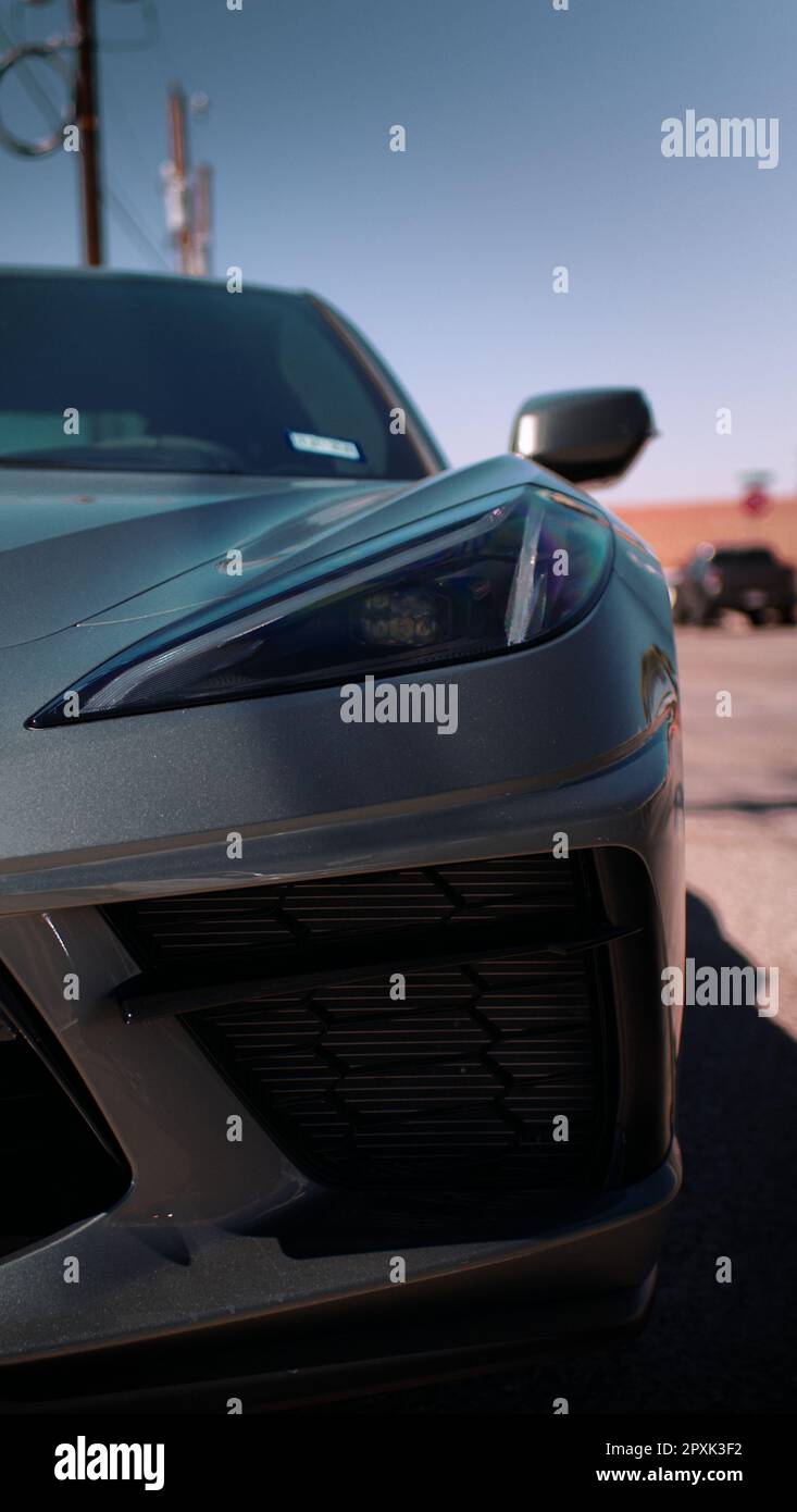 A vertical closeup of a modern gray sports car headlights Stock Photo ...