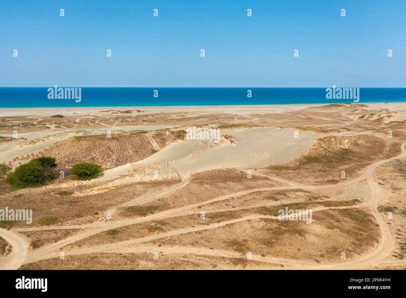 Sandy beach and blue ocean. Paoay Sand Dunes, Ilocos Norte, Philippines ...