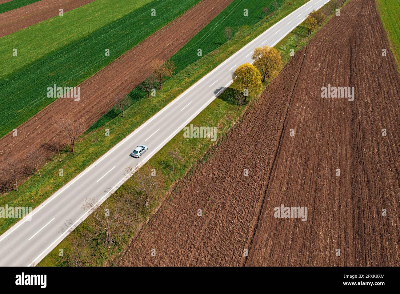 Aerial view of scenic countryside landscape in spring with country road ...