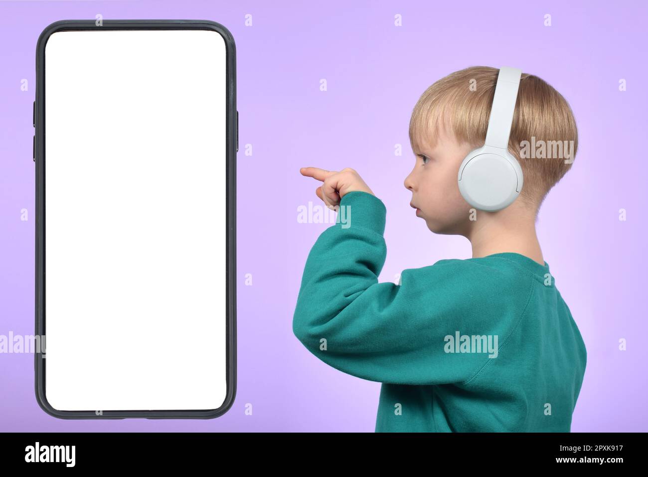 boy child pointing finger at big phone with blank white screen Stock ...
