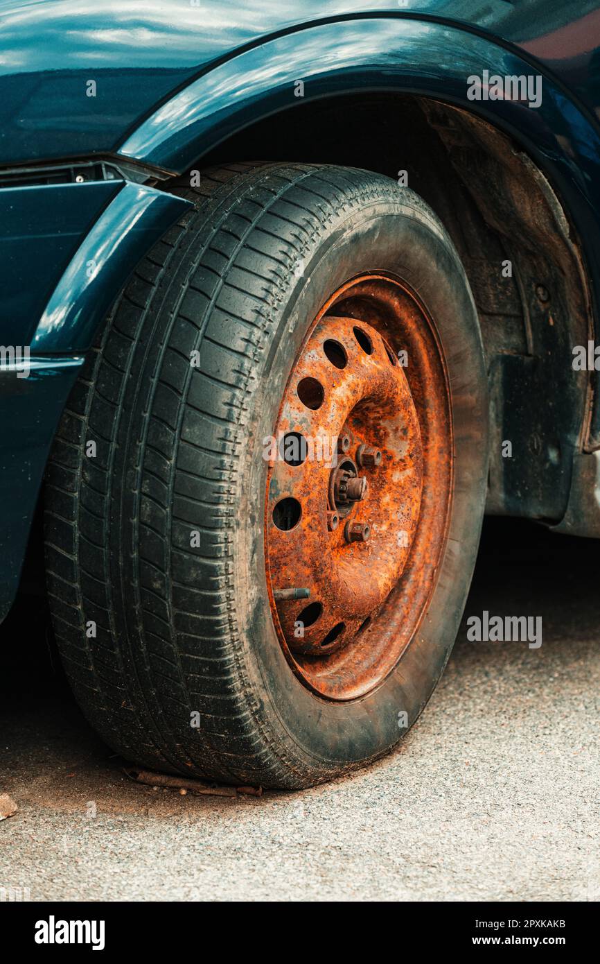 Old rusty car wheel rim and worn tire, selective focus Stock Photo - Alamy