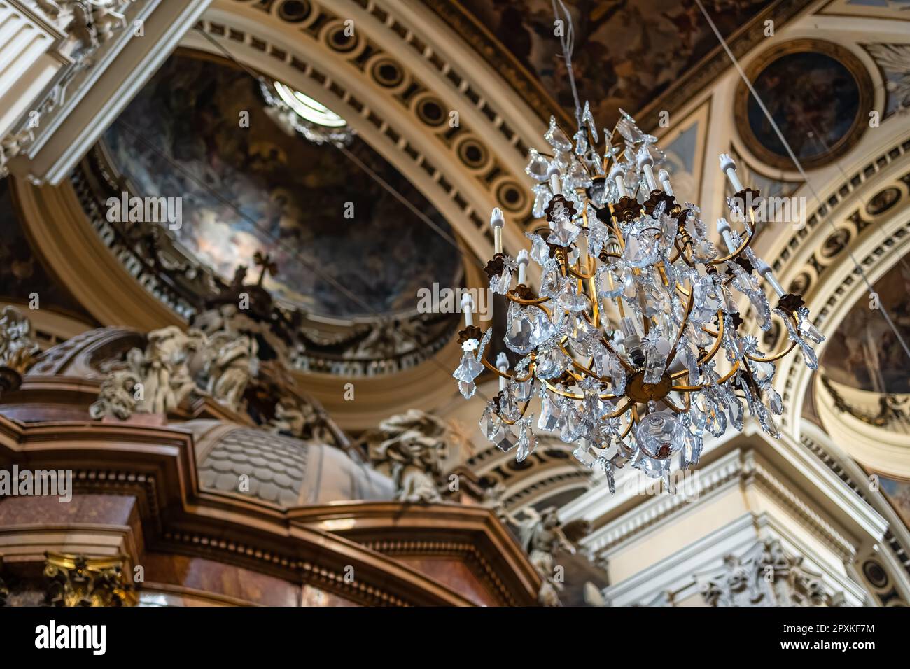 Large glass lamp hanging from the ceiling of the huge cathedral ...