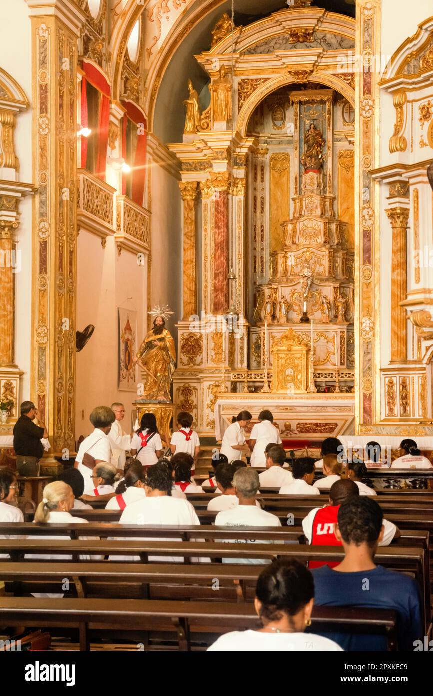 Catholics are inside the Church praying on the day of homage to corpus ...