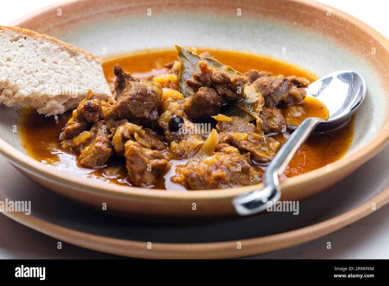 Czech beef goulash served with bread Stock Photo - Alamy